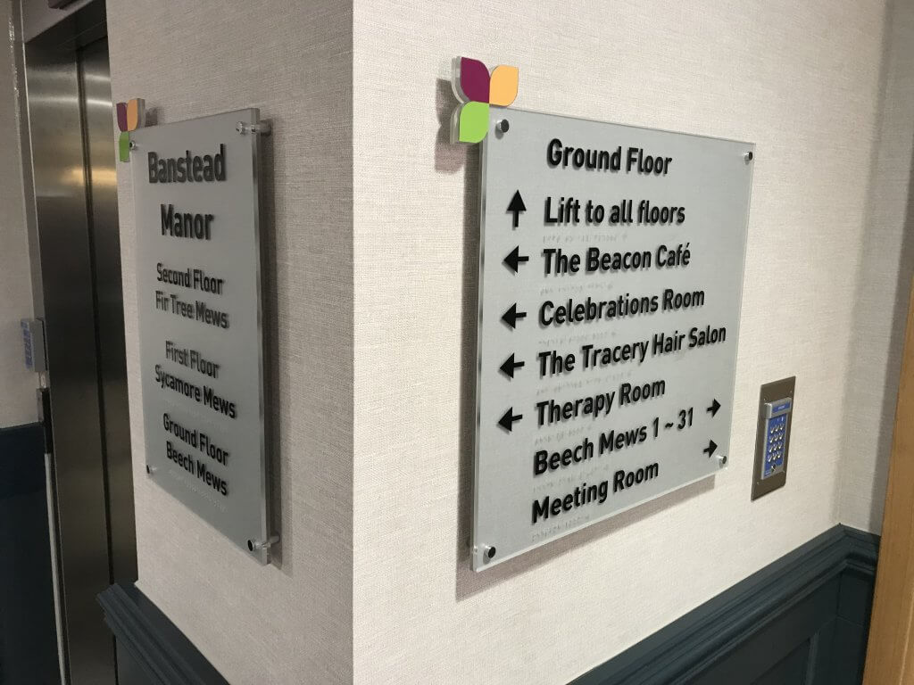 Directional sign with braille - Taylor & Pickles